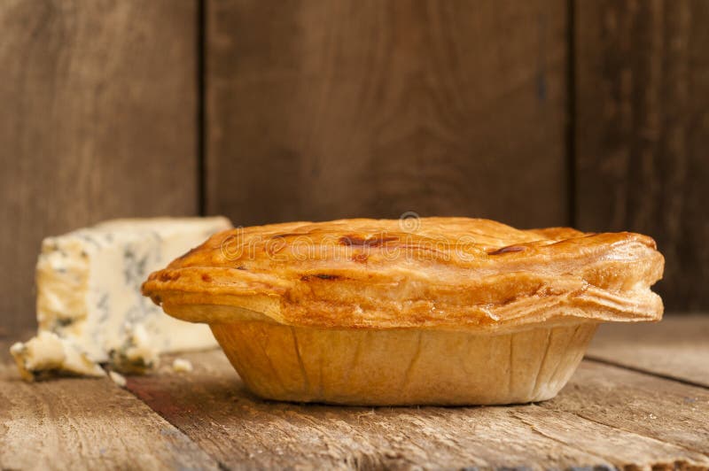 Whole Meat Pie with Cheese in the Background Stock Photo - Image of ...