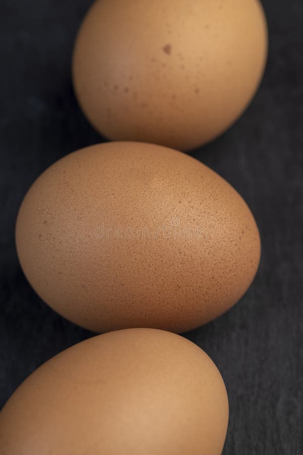 A Whole Orange Chicken Egg Close-up on the Table Stock Image - Image of ...
