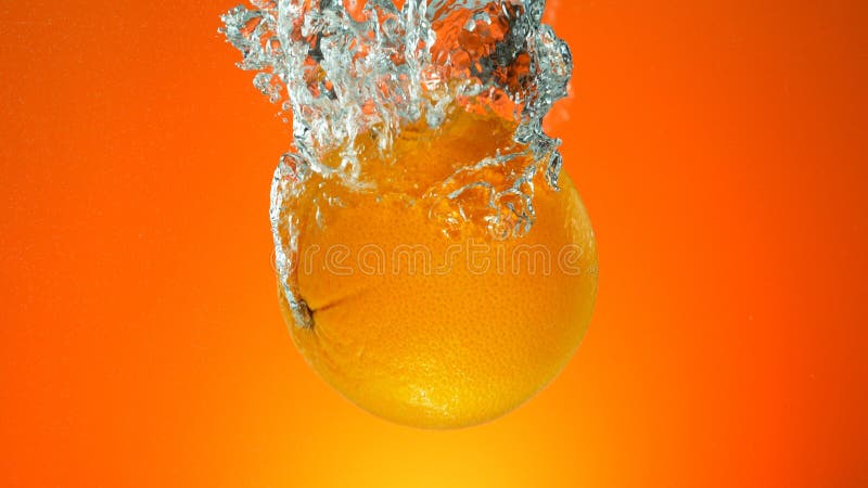 Whole Orange Falling into Water Stock Photo - Image of underwater ...