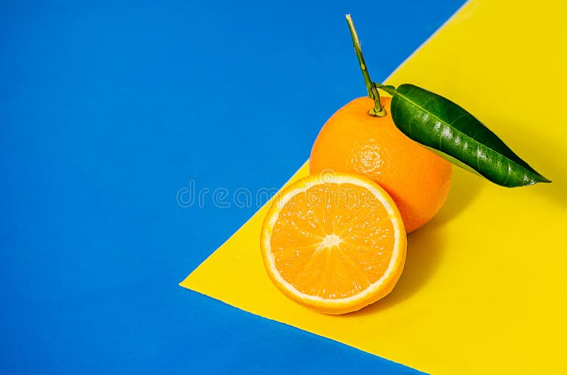 A Whole Orange Split in Half Stock Photo - Image of citric, background ...