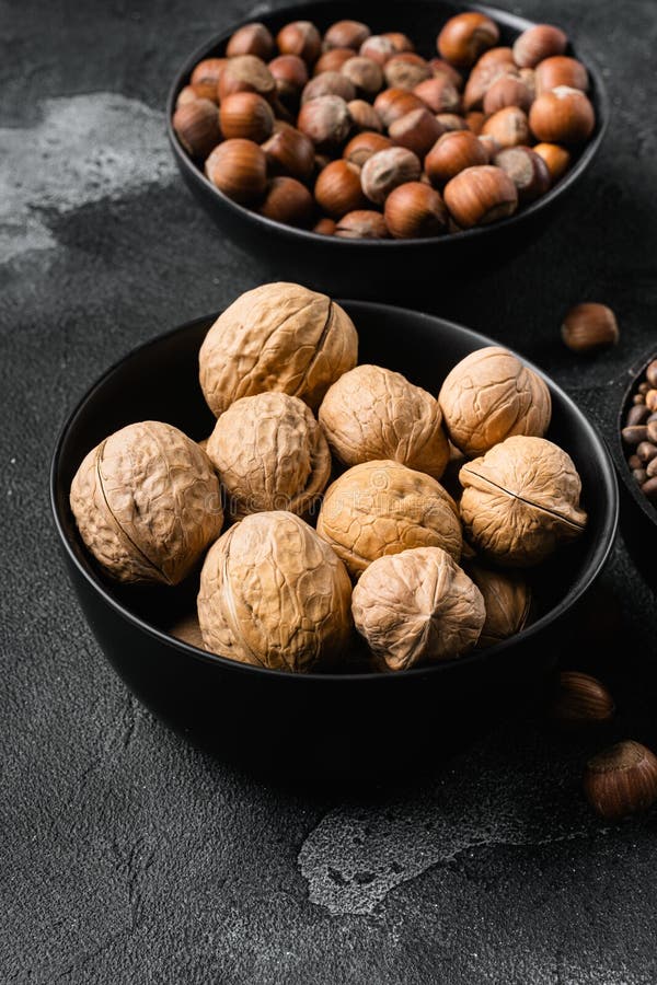 Whole Organic Walnuts, on Black Dark Stone Table Background Stock Photo ...
