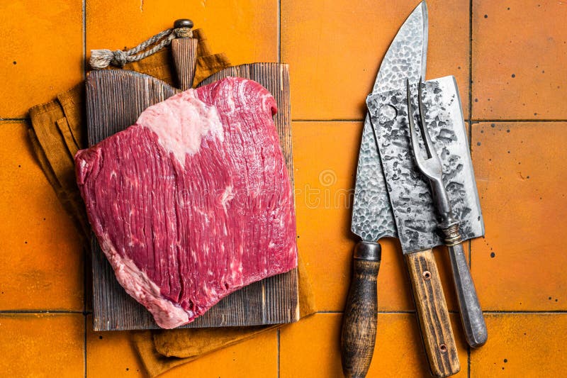 Whole Piece of Raw Beef Brisket Meat. Orange Background Stock Photo ...