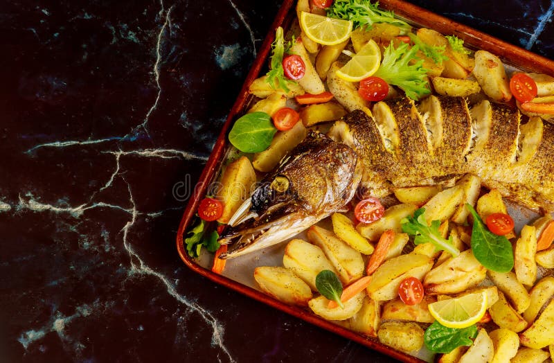 Whole Pike Fish Baked in Baking Tray with Potatoes and Vegetables Stock ...