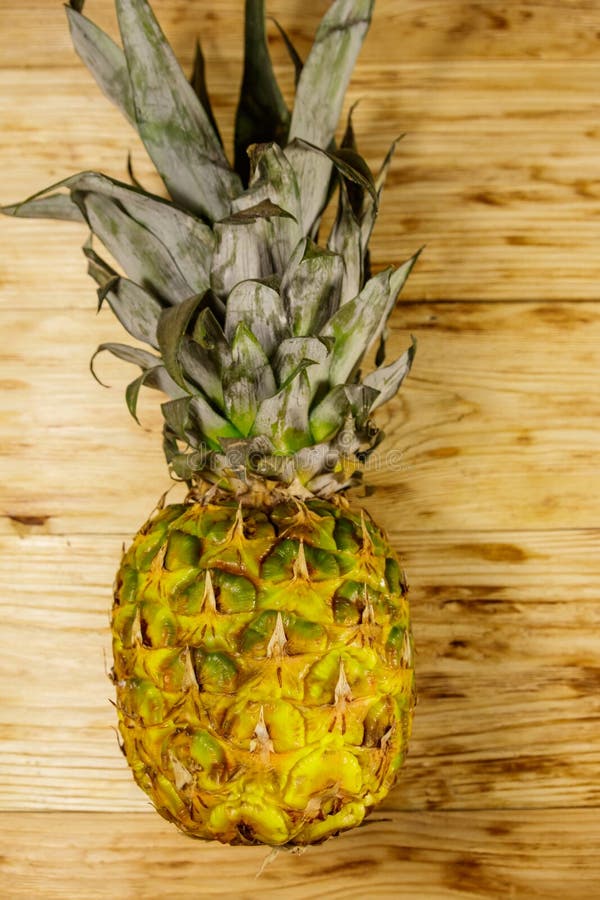 Whole Pineapple on Wooden Table. Top View Stock Photo - Image of fresh ...