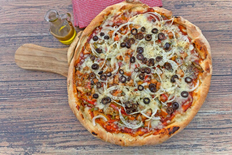 Whole pizza on a table stock image. Image of food, snack - 221584073