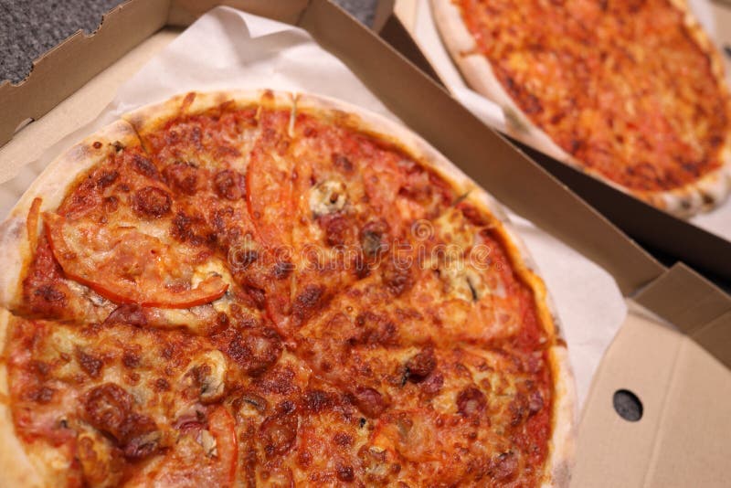Whole Pizzas with Cheese, Ham and Tomatoes in a Delivery Box Stock ...