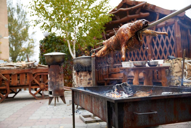 Rabbit On A Spit On The Grill Roasts Stock Photo - Image of grilling ...