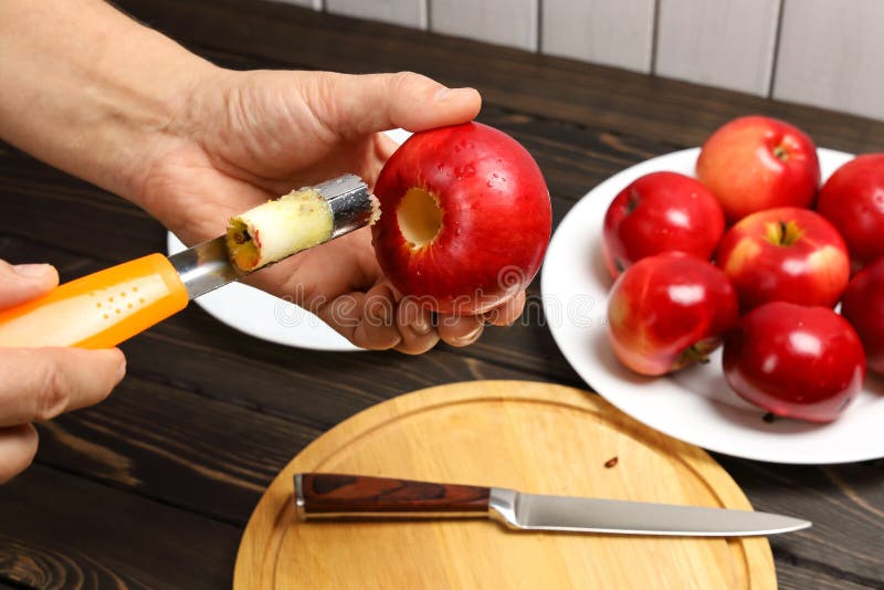 Whole Red Apple in Hand, Man with Special Knife Cuts Core from an Apple ...