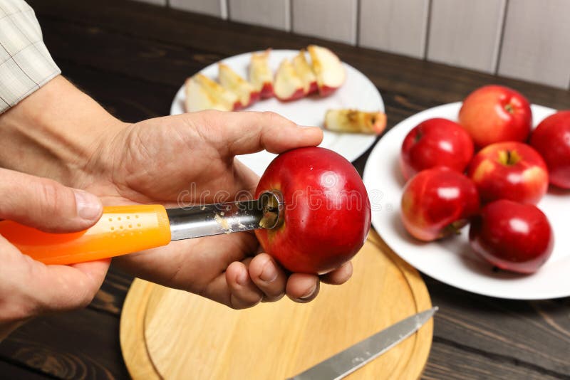 Whole Red Apple in Hand, Man with Special Knife Cuts Core from an Apple ...