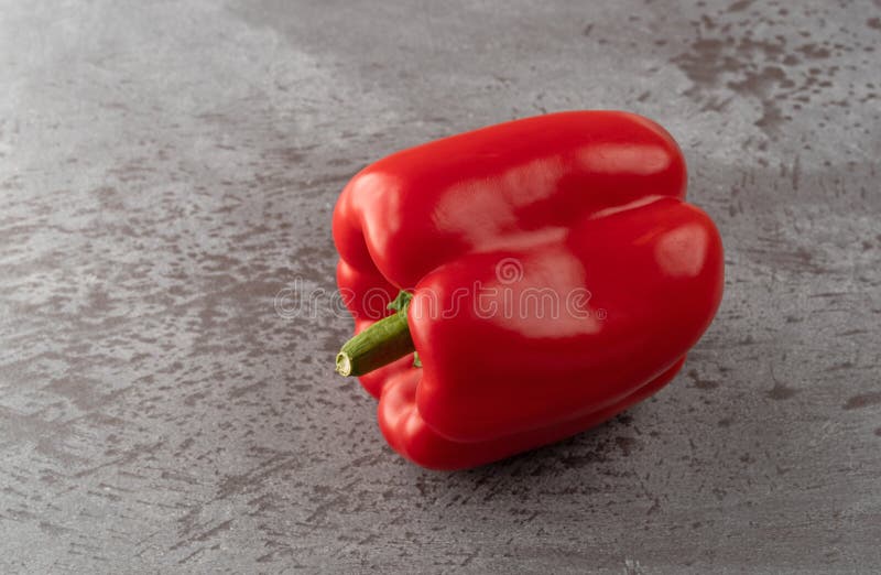 Whole Red Bell Pepper on a Gray Counter Top Stock Photo - Image of ...