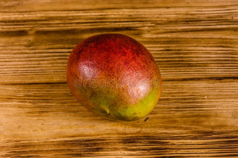 Whole Red Mango Fruit on a Wooden Table Stock Image - Image of fruit ...