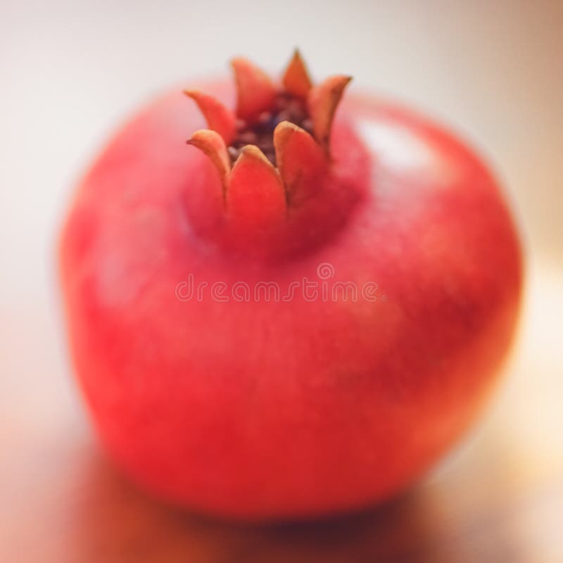 Whole Ripe Pomegranate Close Up on the Sunny Table Stock Image - Image ...