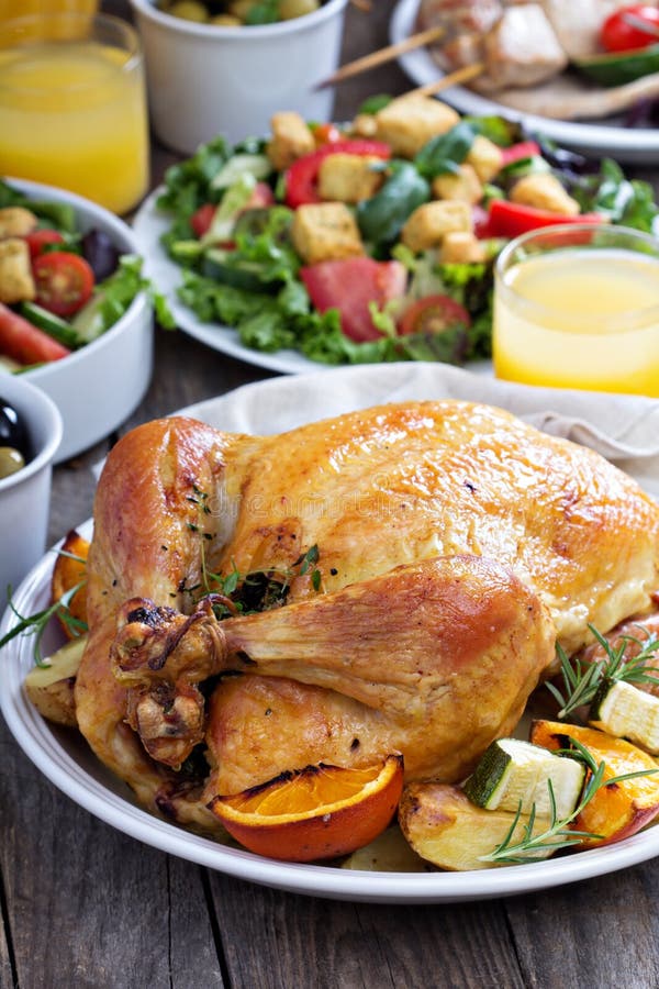 Whole Roasted Chicken on Dinner Table Stock Image - Image of parsley ...