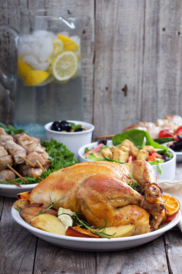 Whole Roasted Chicken on Dinner Table Stock Image - Image of parsley ...