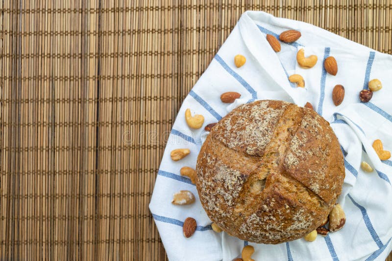 Whole Rye Bread with Mixed Nuts on White Cloth with Stripe. Stock Photo ...