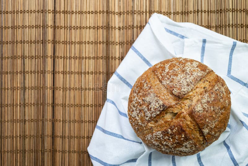 Whole Rye Bread Placed on White Cloth with Blue Stripe. Stock Photo ...