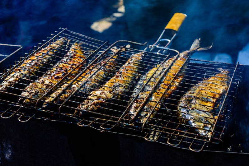 Whole Scomber Fish Cooking in a Metal Grate Grill Stock Photo - Image ...