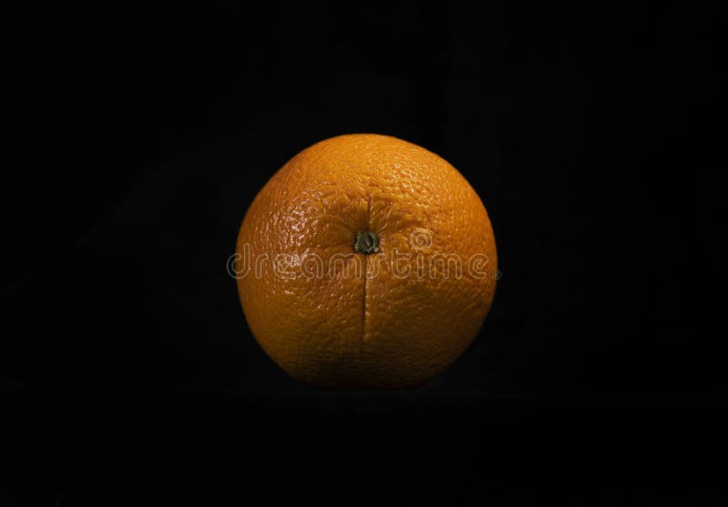 A Single Orange Slice on a Black Background. Stock Photo - Image of ...