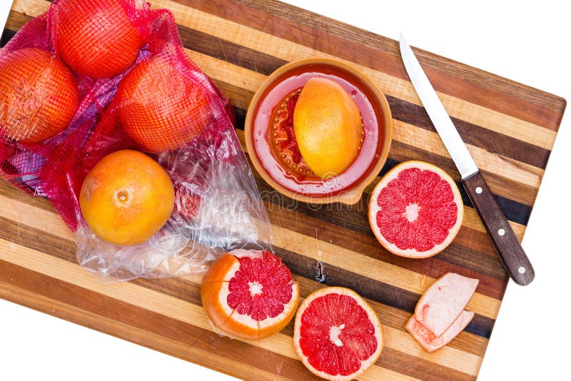 Whole and Sliced Ruby Red Grapefruit with Knife Stock Photo - Image of ...