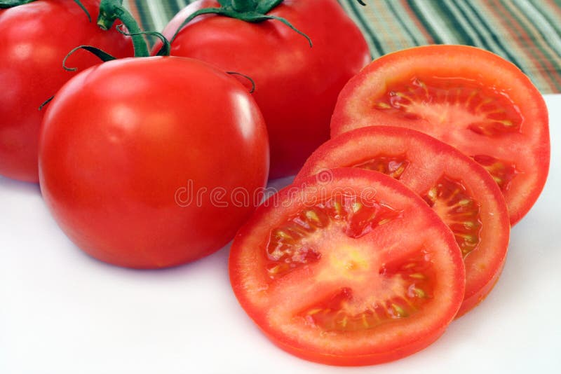 Whole and Sliced Tomatoes stock image. Image of delicious - 5514099
