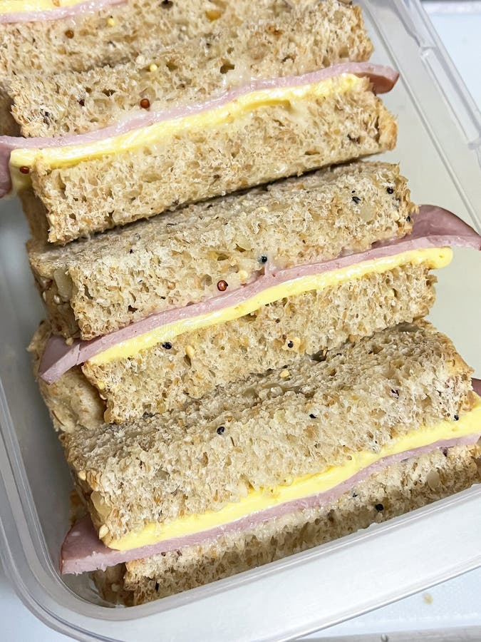 Whole Wheat Sandwich Toast with Ham and Cheese in a Plastic Box Stock ...