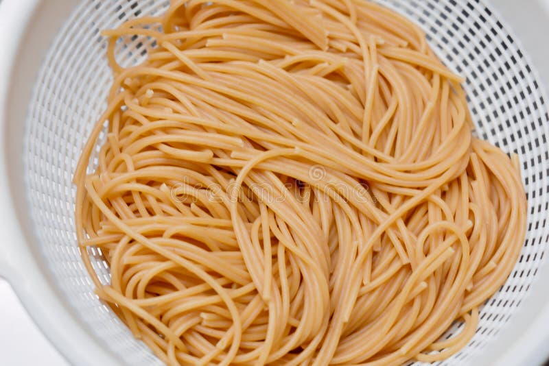 Whole Wheat Spaghetti Cooked in a Colander Stock Photo - Image of ...