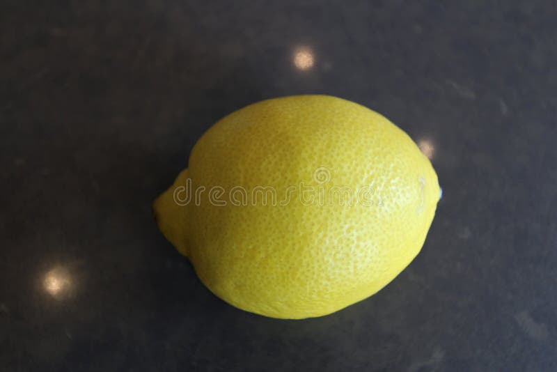 A Whole Lemon on a Gray Surface Stock Image - Image of single, lemon ...