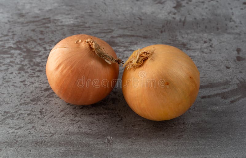 Whole Yellow Onions on a Gray Counter Top Stock Photo - Image of food ...
