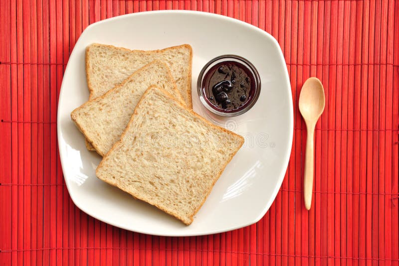 Wholewheat Bread with Jam on Red Background Stock Photo - Image of ...