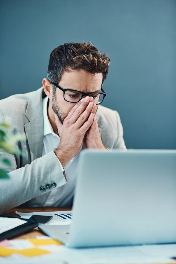 Why Does this Laptop Keep Crashing. a Young Businessman Looking ... Why Does this Laptop Keep Crashing. a Young Businessman Looking ...