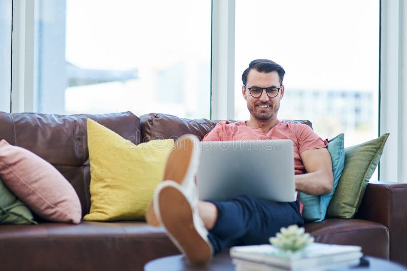 Why Would You Want To Work Anywhere Else. a Young Man Using a Laptop ...