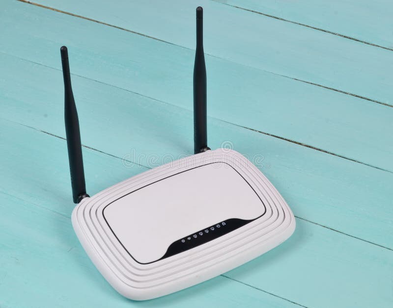 Wi-fi Router with Antennas on a Blue Wooden Table. Stock Photo - Image ...