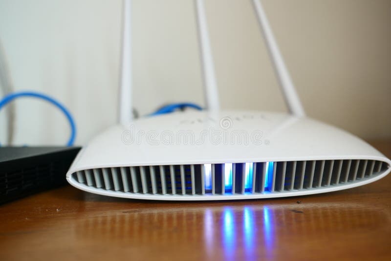 Wi-Fi Router with Cables on Table Stock Photo - Image of fiber ...