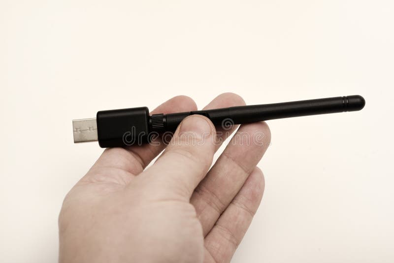 Wi-Fi Router in Hand on a White Background. USB Bluetooth Adapter for ...