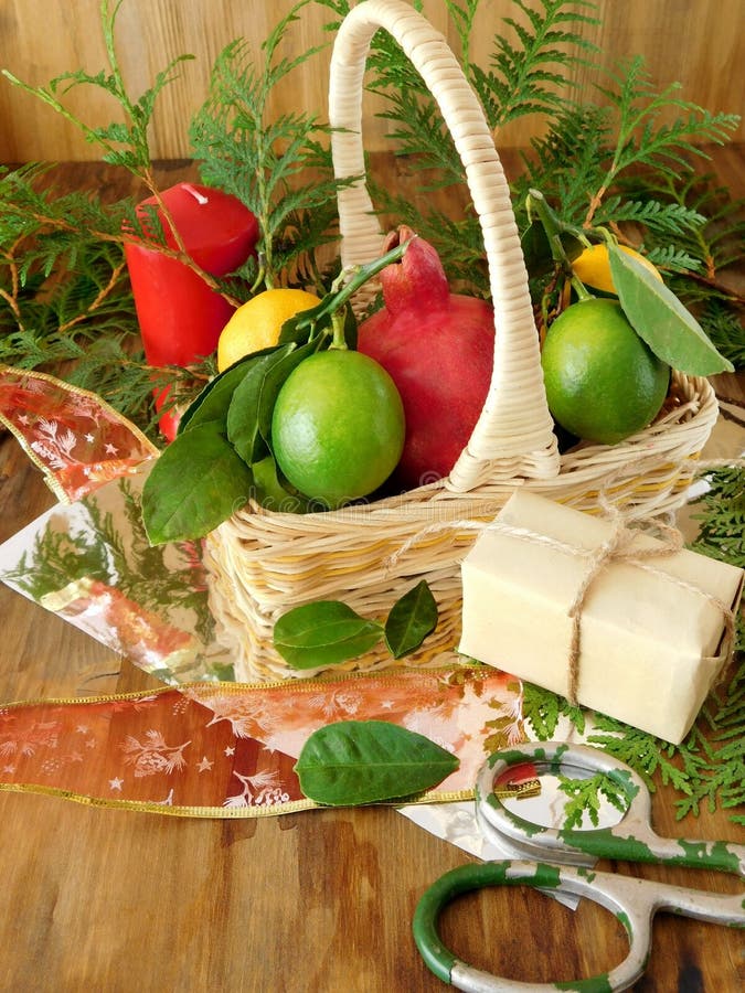 A Wicker Basket Filled with Fruits Surrounded by Present Boxes and ...