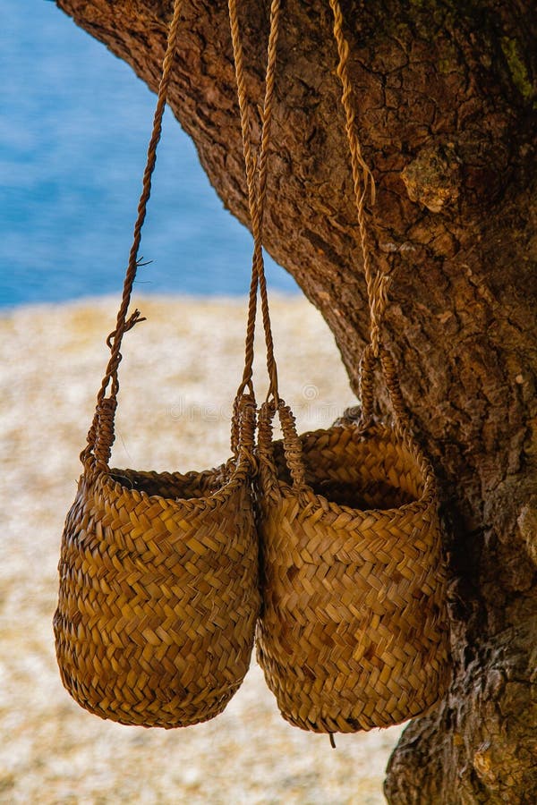 Wicker Baskets Hanging from a Tree Near the Beach in Spain Stock Photo ...