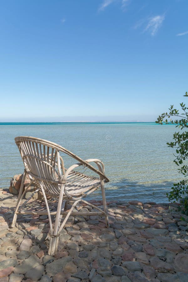 Wicker Chair on Beach stock image. Image of armchair - 68919319