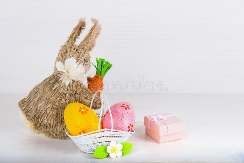 Wicker Easter Bunny with Easter Eggs in Basket on White Wooden B Stock ...