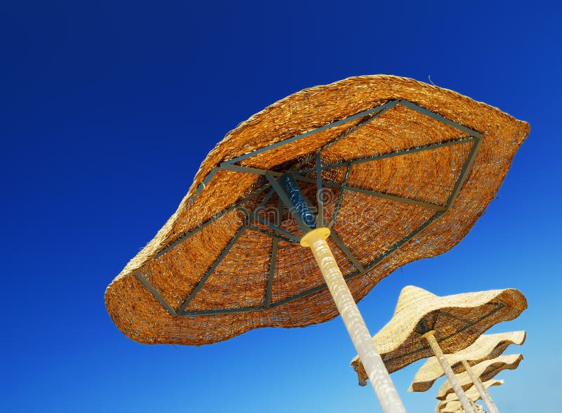 Wicker umbrella stock photo. Image of umbrella, cloudless - 56571902