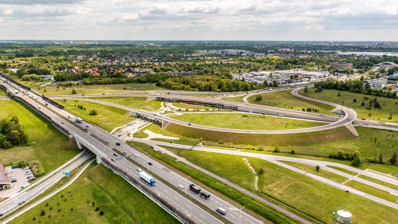 Expansive Aerial View of Highway Junction Surrounded by Green Landscape ...
