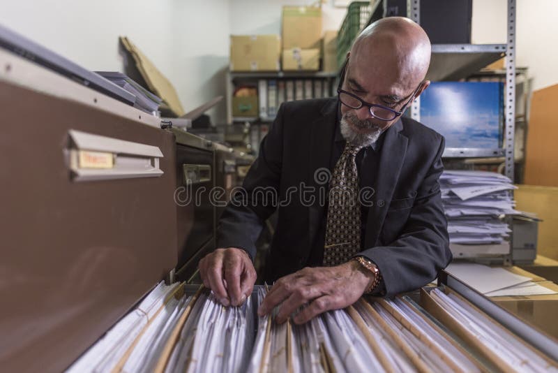 Wide Angle Image of Senior Man Looking Files Stock Image - Image of ...