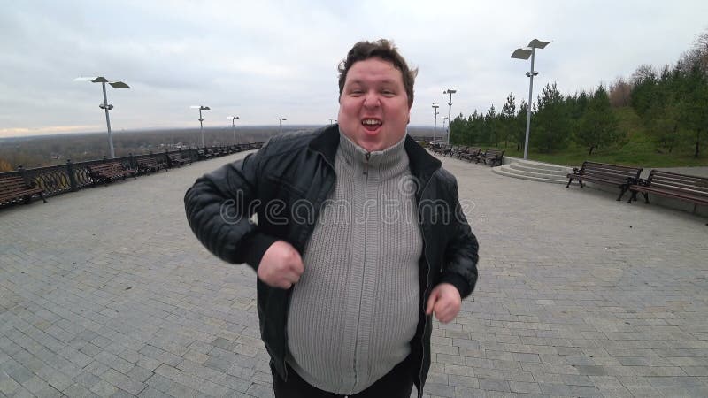 Wide Angle Lens: Young Fat Man is Dancing Outdoor Stock Footage - Video ...