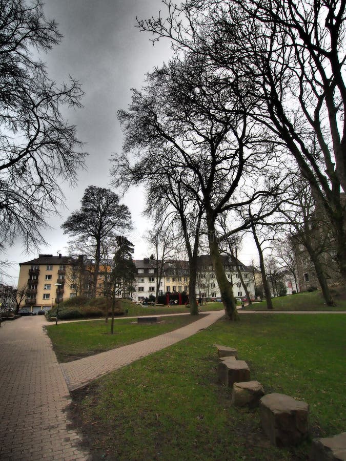 Wide Angle Shot of a Building Surrounded by Trees and a Park Stock ...