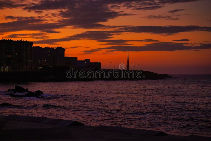 Wide Angle Shot the Buildings of a City in Front of the Water during a ...