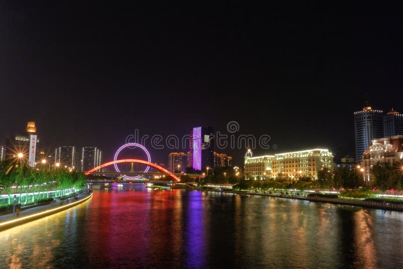 Wide Angle Shot of the Lights of the City Reflected Over the Water at ...