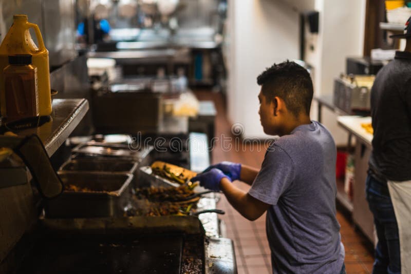 Wide Angle Shot of a Man Cooking in a Restaurant Editorial Stock Photo ...