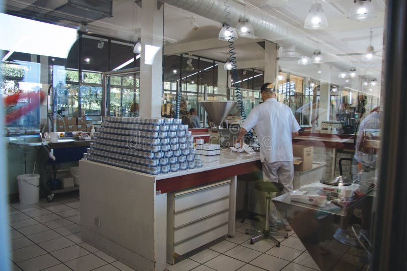 Wide Angle Shot of a Man in White Uniform Working at a Factory ...