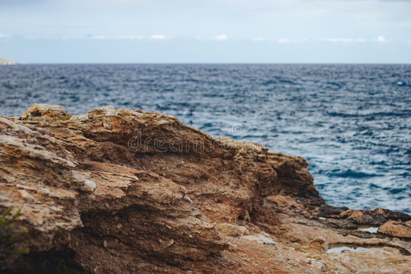 Wide Angle Shot of a Rocky Beach Surrounded by Water Stock Photo ...