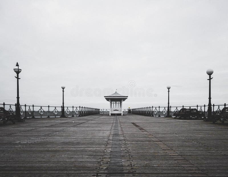 Wide Angle Shot of a Small Construction on a Wooden Platform Surrounded ... Wide Angle Shot of a Small Construction on a Wooden Platform Surrounded ...