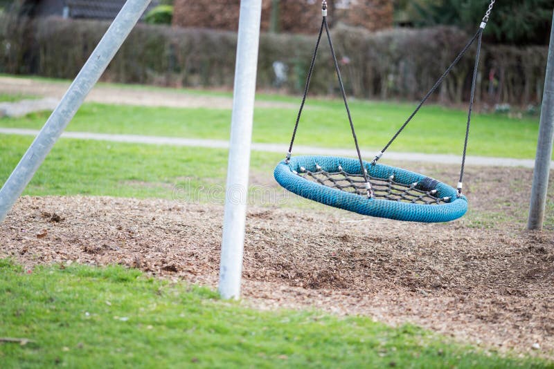 Wide Angle Shot of a Swing Surrounded by Green Grass Stock Image ...
